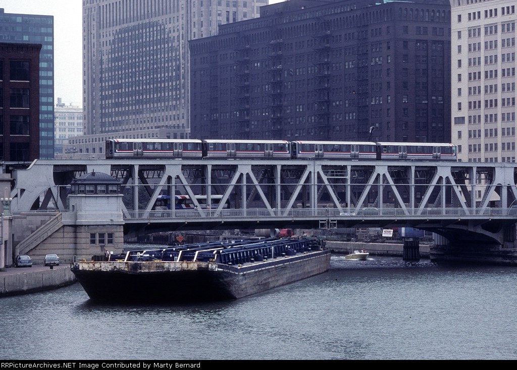 A Lake-Dan Ryan Train and a Greyhound Bus Cross the Lake Street Bridge
